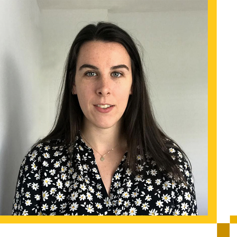 A woman, process engineer, smiling, dressed in a floral blouse
